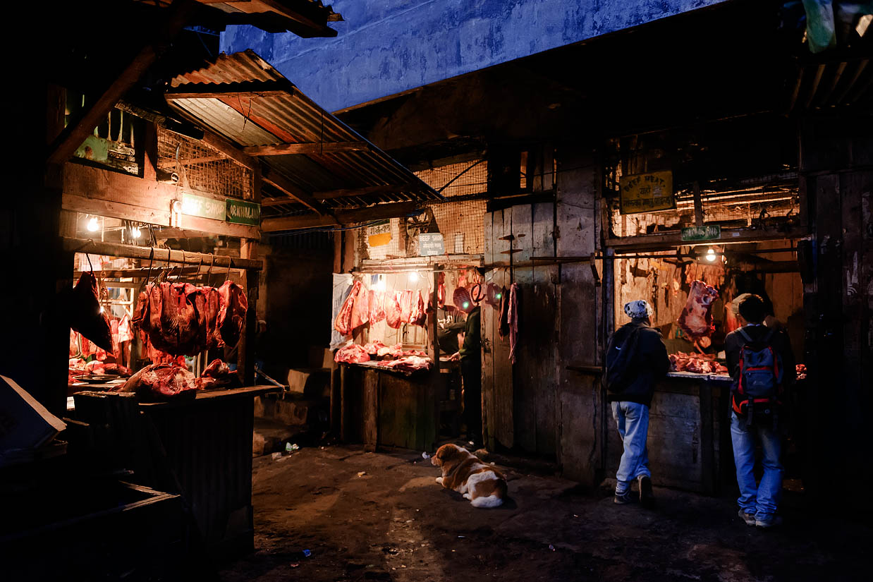 editorial travel photography | a street meat market at night main ...